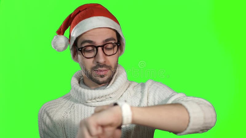 Man in the Hat of Santa Claus Using Smartwatch Touchscreen, Cute Smiles ...