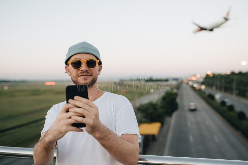 Man in Hat and Sunglasses Standing on the Bridge Stock Image - Image of ...