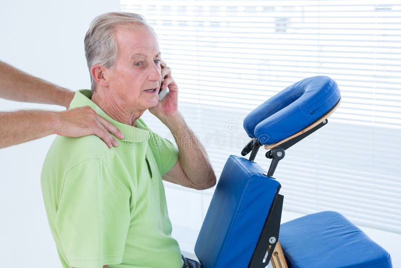 Man Having Back Massage while Talking on the Phone Stock Image - Image ...
