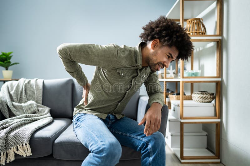 Man Having Backache while Sitting Stock Photo - Image of sickness, home ...