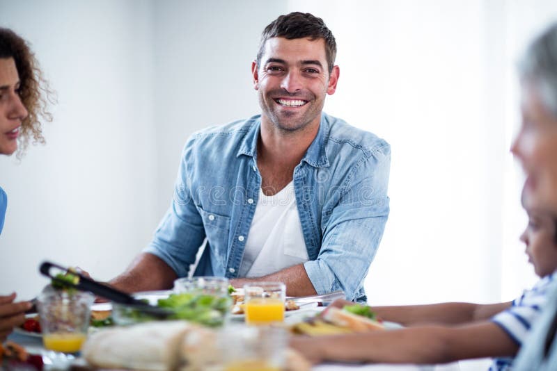 Man Having Breakfast with Family Stock Photo - Image of apartment ...