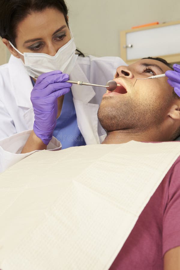 Man Having Check Up at Dentists Surgery Stock Image - Image of forties ...