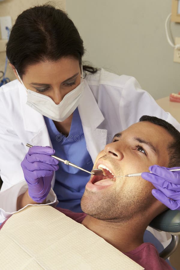 Man Having Check Up at Dentists Surgery Stock Image - Image of american ...