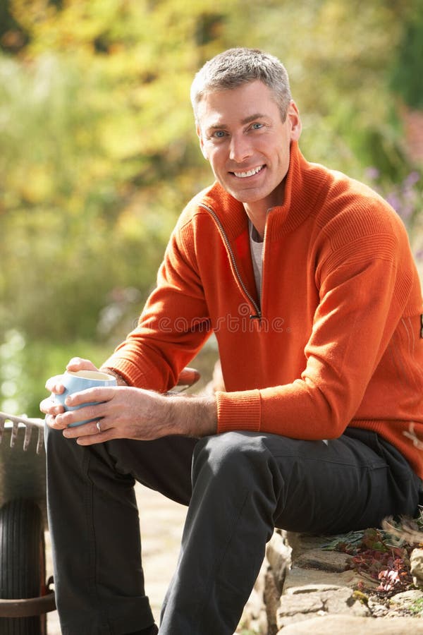 Man Having Coffee Break Whilst Working Outdoors Stock Image - Image of ...