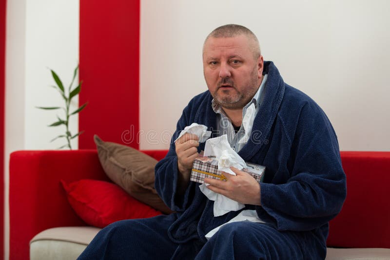 Man Having a Cold Holding Tissue with Box Full of Tissues Stock Image ...