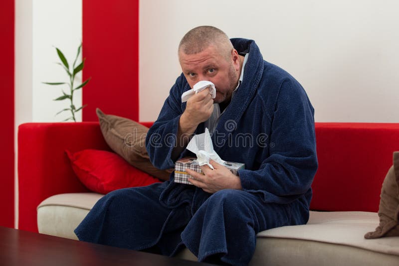 Man Having a Cold Holding Tissue with Box Full of Tissues Stock Photo ...