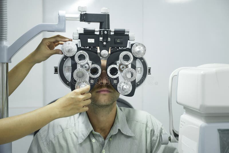 Man Having Eye Test Using Phoropter. Stock Image - Image of goggles ...