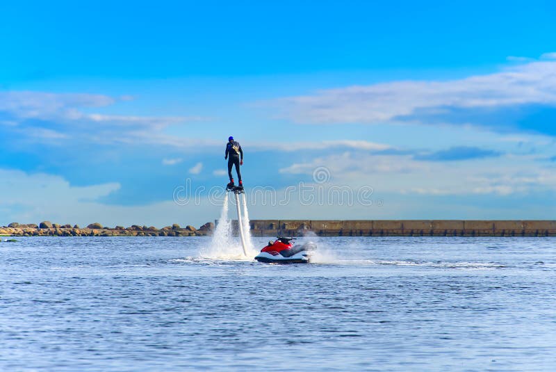 Man Having Fun on Flyboard. Flyboarding in a Sunny Summer Day at River ...