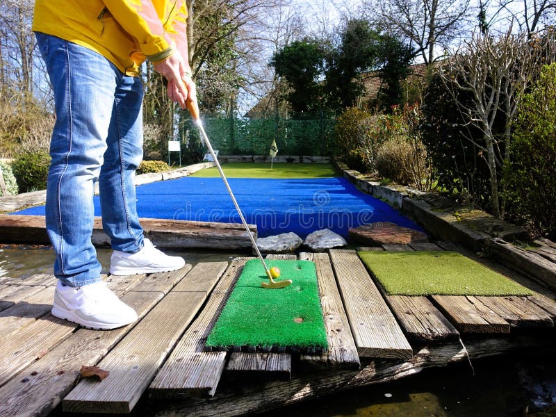 Man Having Fun Playing Miniature Golf Stock Photo - Image of sport ...