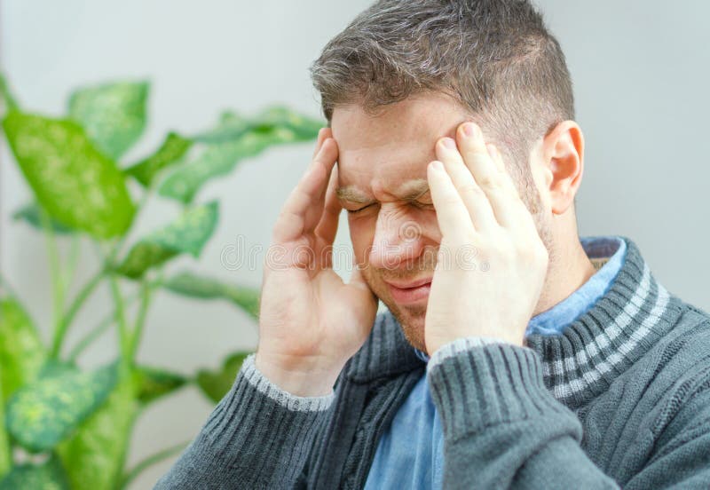 Man having a headache. stock image. Image of headache - 133608855