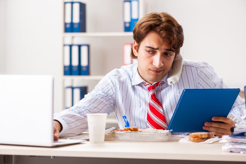 The Man Having Meal at Work during Break Stock Photo - Image of hungry ...