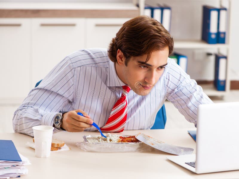 Man Having Meal at Work during Break Stock Photo - Image of meal, busy ...