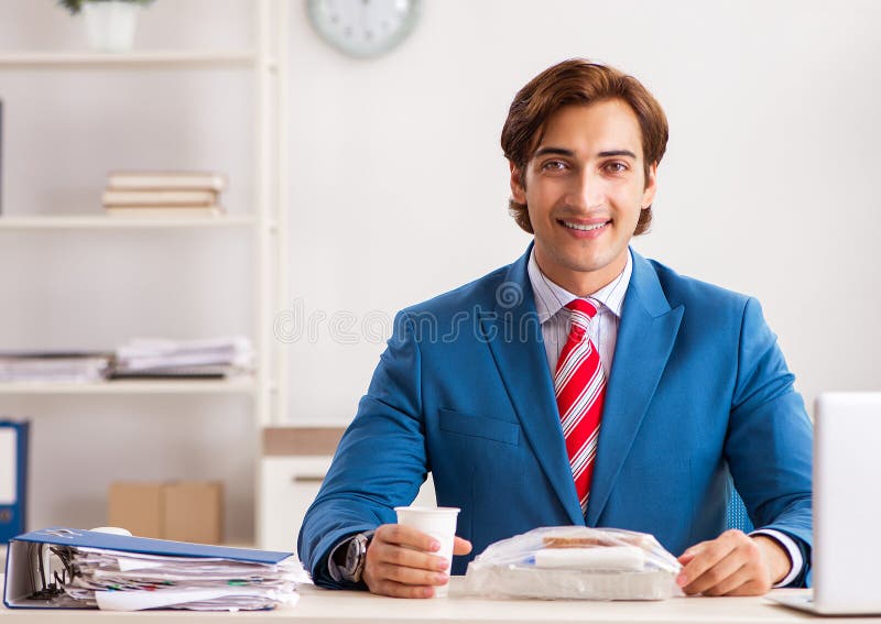 Man Having Meal at Work during Break Stock Photo - Image of business ...