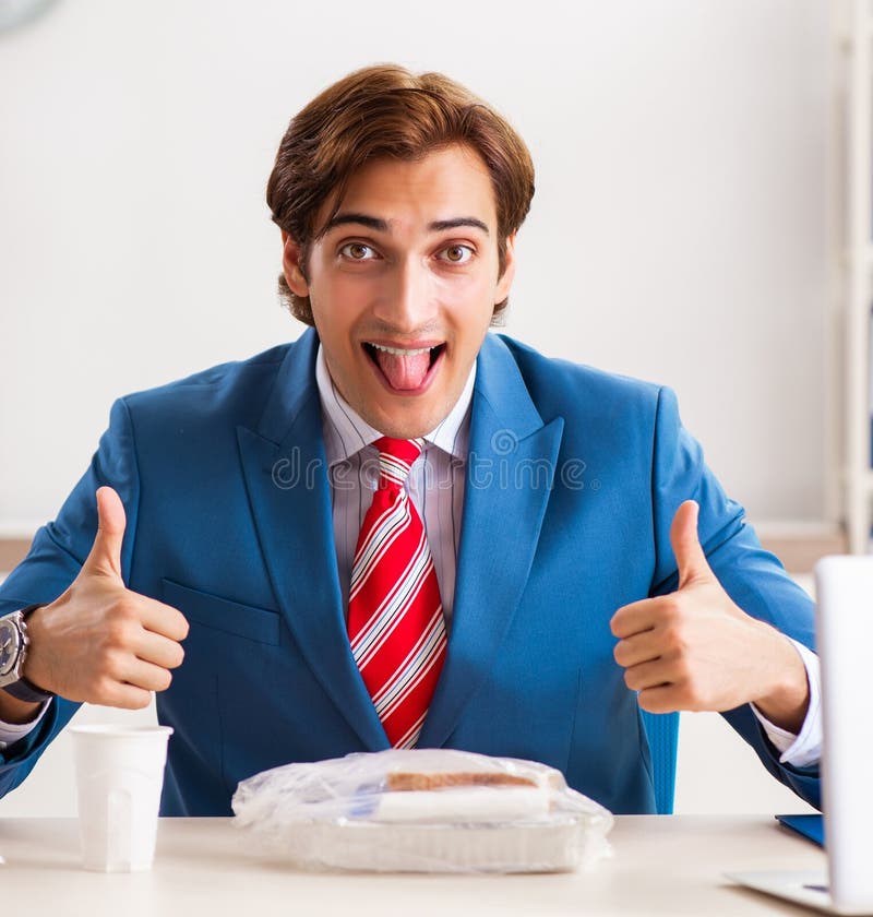 Man Having Meal at Work during Break Stock Photo - Image of paper ...