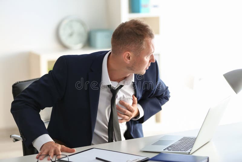 Man Having Panic Attack at Workplace in Office Stock Photo - Image of ...