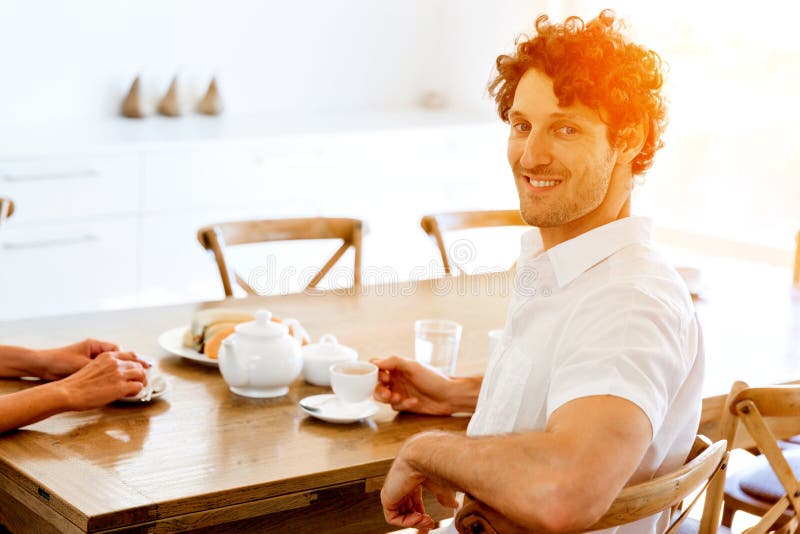 Man having tea at home stock image. Image of handsome - 106657399
