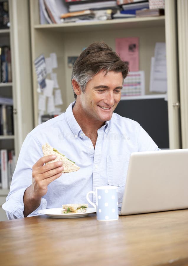 Man Having Working Lunch in Home Office Stock Image - Image of internet ...