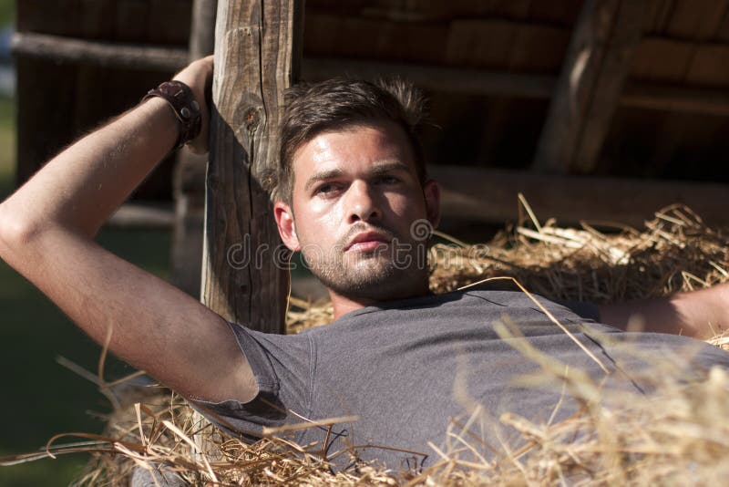 Man on hay stock image. Image of adult, boys, people - 25933279