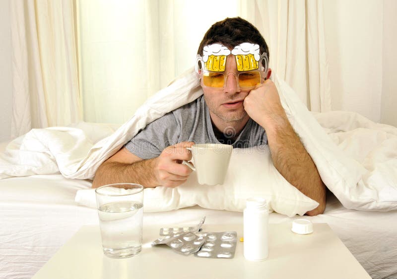 Man with Headache and Hangover in Bed with Tablets Stock Photo - Image ...