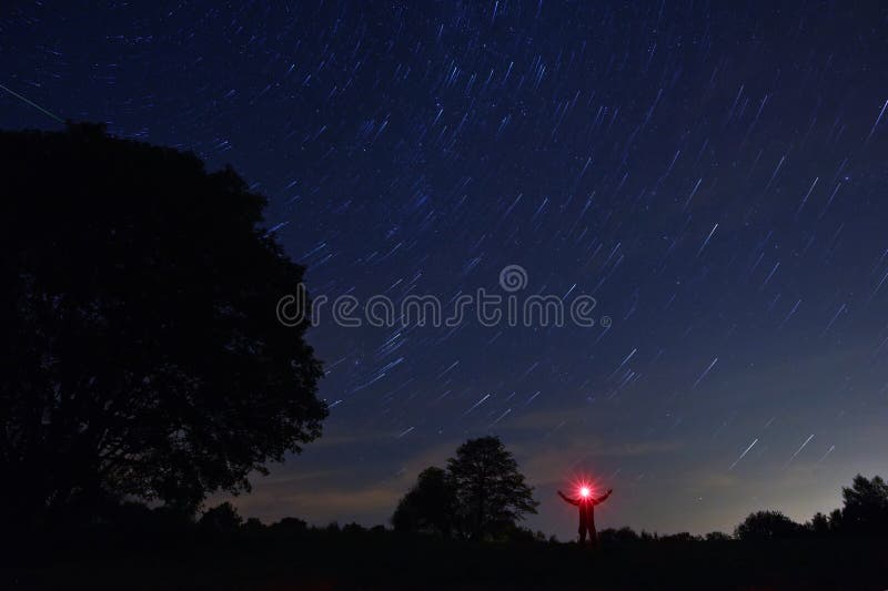 A Man with a Headlamp Looks at the Starry Sky. Stock Photo - Image of ...