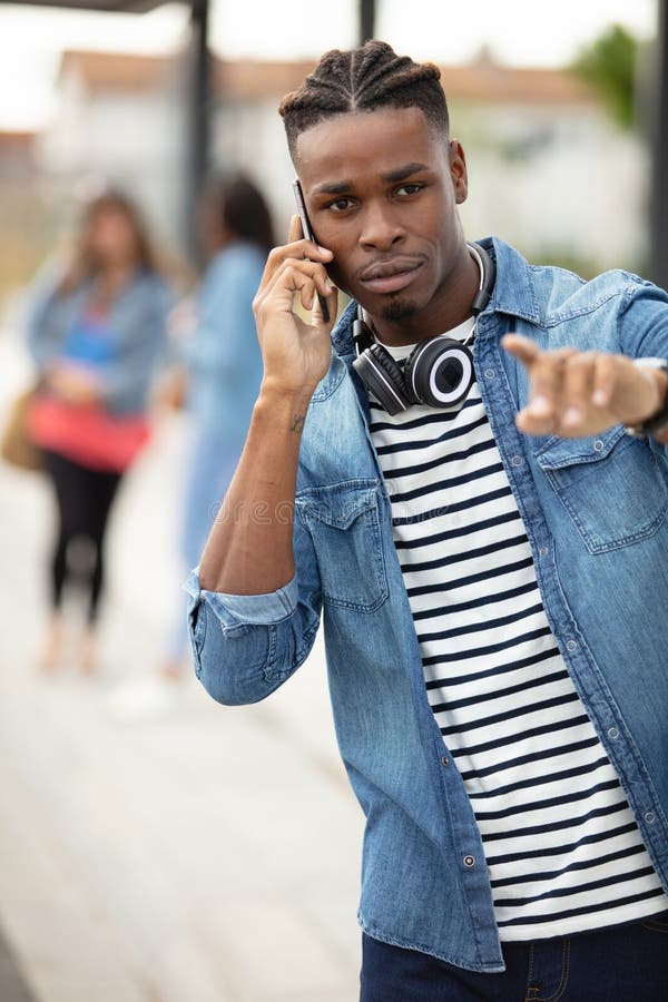 Man with Headphone Calling Phone in Street Stock Photo - Image of ...