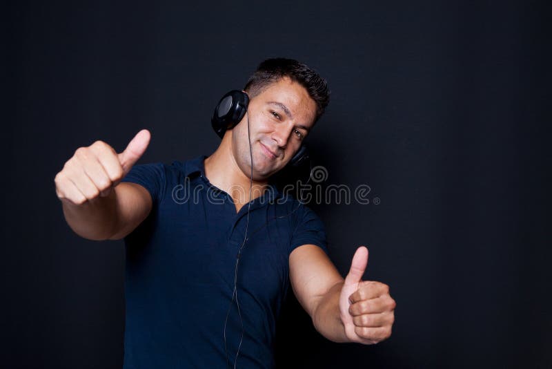 Man with Headphones on His Ears and Making Ok Sign Stock Image - Image ...