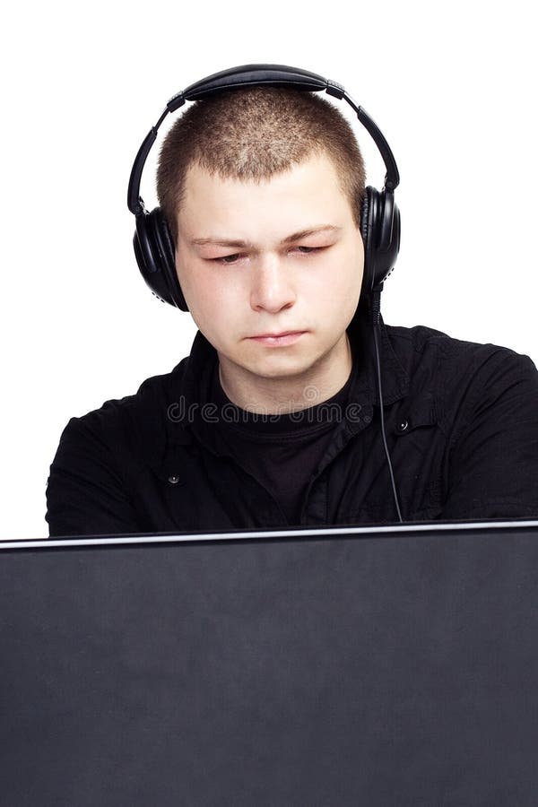 Man with Headphones Looking in Computer Stock Image - Image of hacking ...