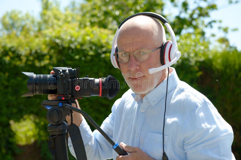 Man with Headphones, Using a Camera Dslr Stock Image - Image of ...