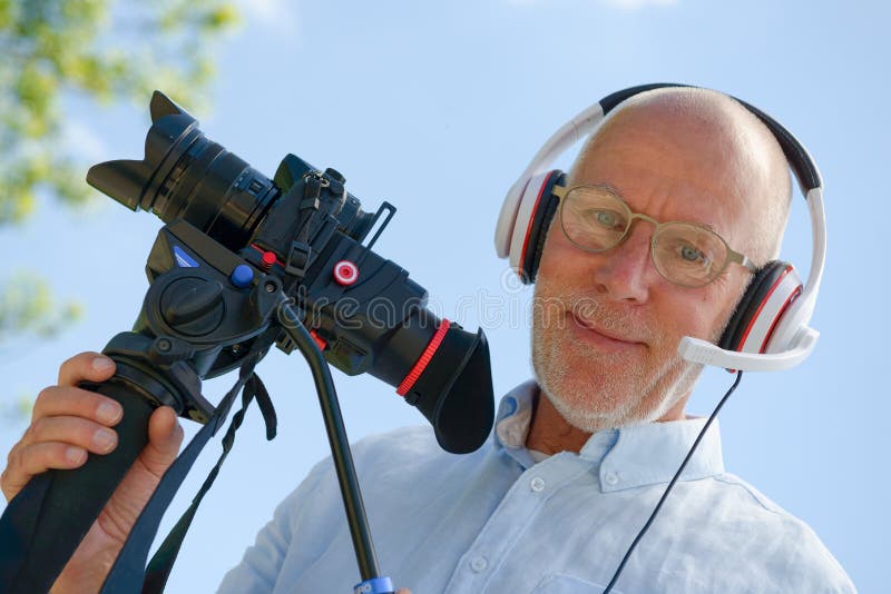 Man with Headphones, Using a Camera Dslr Stock Photo - Image of film ...