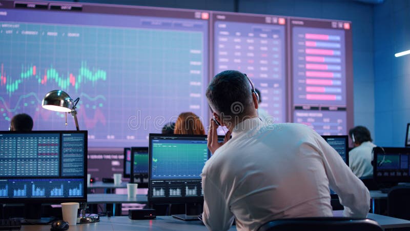 Male Trader Using Computer To Trade Stocks Stock Photo - Image of ...