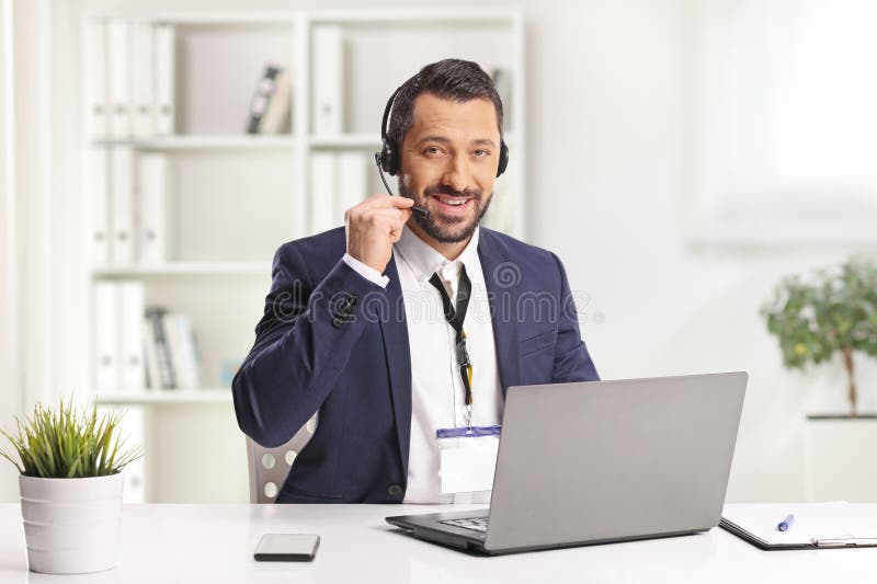 Man with a Headset Working on a Laptop Computer Stock Photo - Image of ...