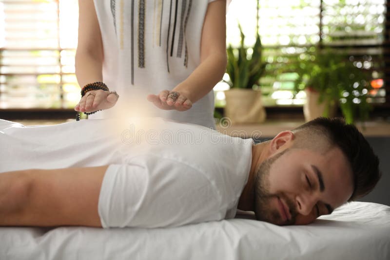 Man during Healing Session in Therapy Room Stock Photo - Image of heal ...