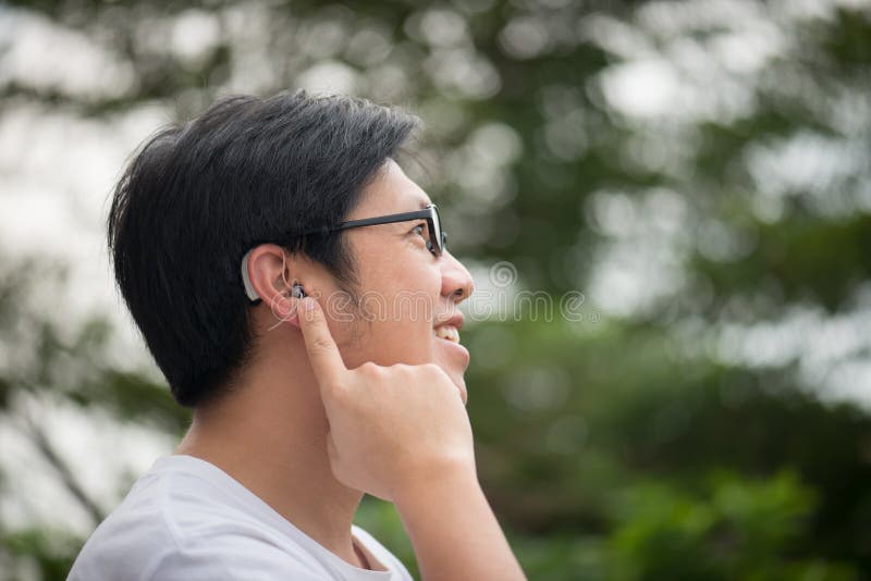 Man with Hearing Aid Behind the Ear Stock Image - Image of adult, asian ...