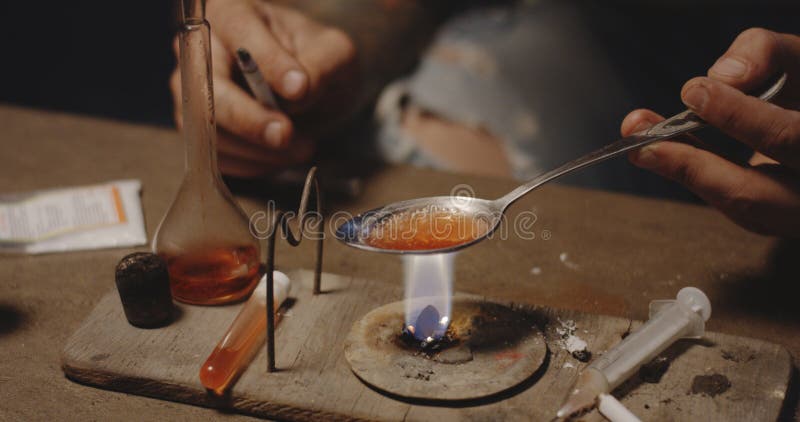 Man Heating Drug in a Spoon Stock Photo - Image of addiction, dope ...