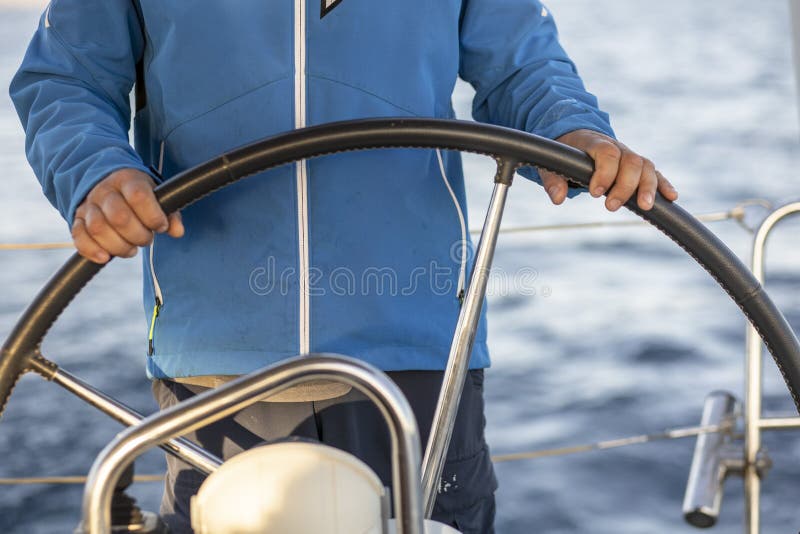A Man at the Helm of a Sailing Yacht Stock Photo - Image of spain ...