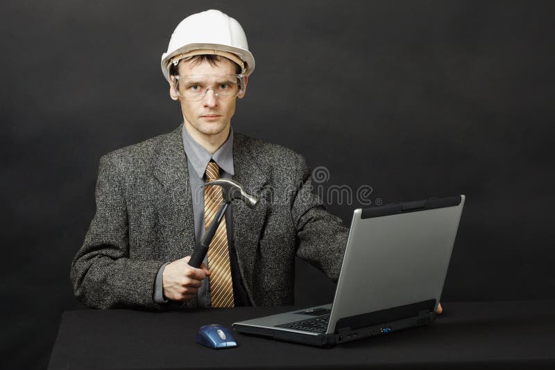 Man in Helmet with Hammer Repairs Computer Stock Photo - Image of ...