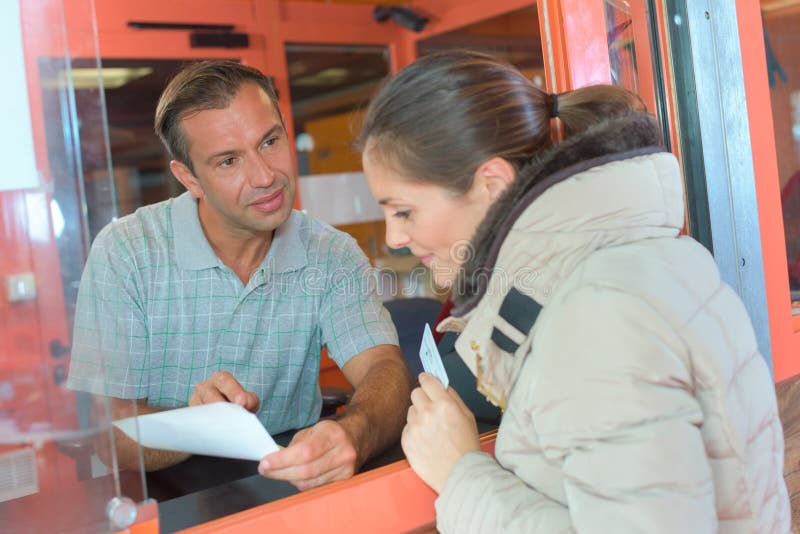 Man helping customer stock image. Image of worker, smiling - 208759641