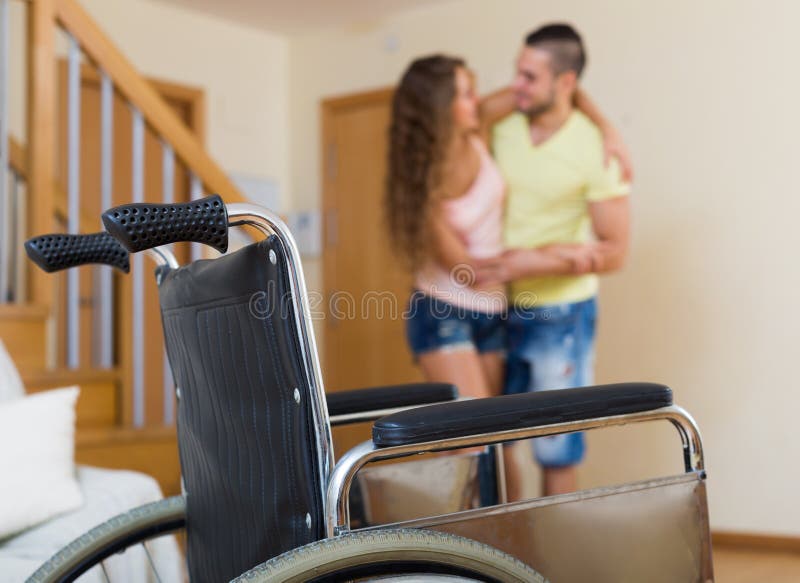 Man Helping His Disabled Wife Stock Image Image Of Indoor Couple