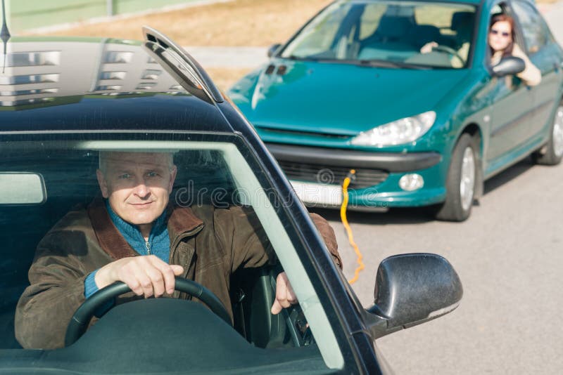 Man Helping Woman by Pulling Her Car Stock Photo - Image of service ...