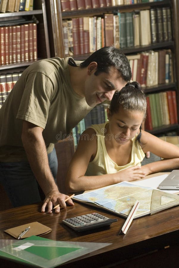 Man Helping Woman Study - Vertical Stock Image - Image of students ...