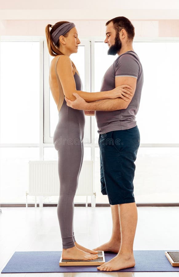 Man Helping Woman To Stand On Sadhu Yoga Board Stock Image Image Of