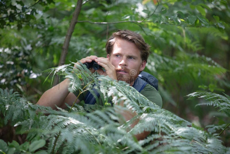 Man hidden in nature stock photo. Image of sunset, camera - 264392690