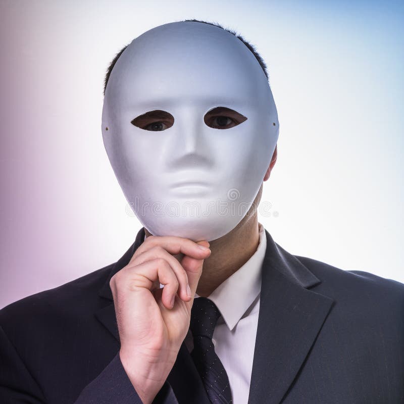A Man Hides His Face with a Mask, a Concept on the Theme of Espionage ...