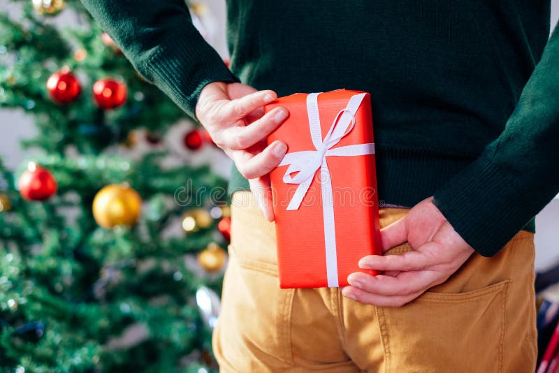 Man Hiding Behind His Back a Christmas Gift Box Stock Image - Image of ...