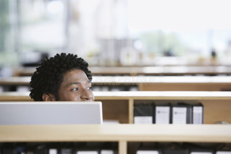 Man Hiding Behind Office Desk Stock Photo - Image of hair, worker ...