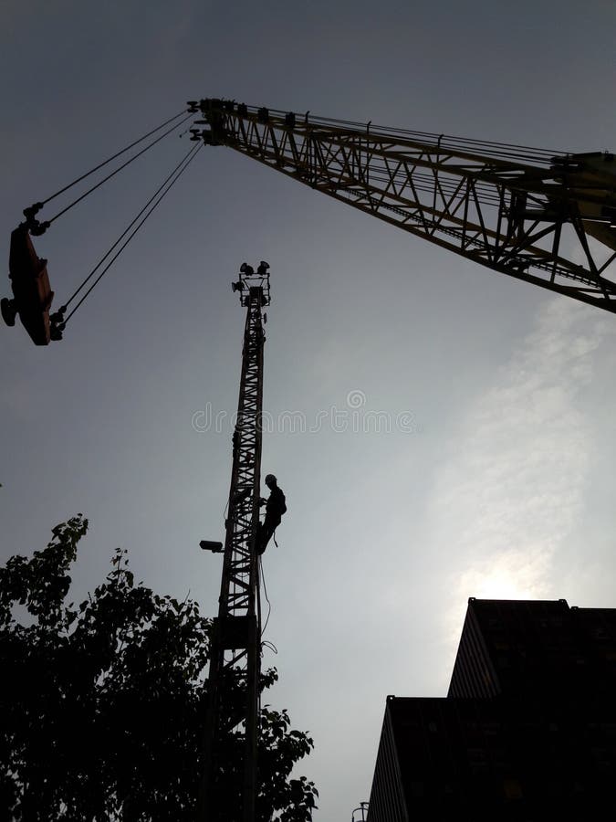 Man on high mast lighting stock photo. Image of high - 91262512