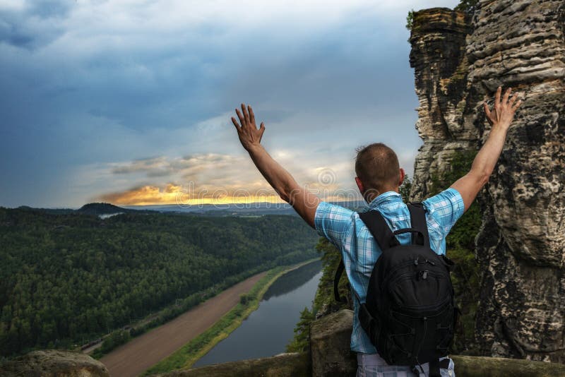 Man High in the Mountains Raised His Hands To the Sunset Stock Photo ...