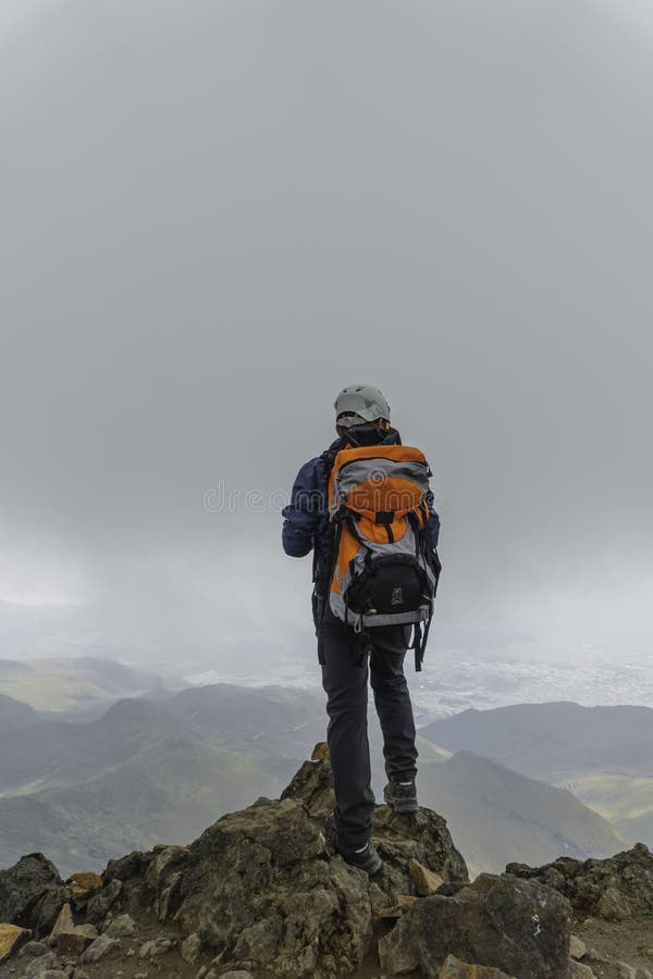 Man Hiker with Backpack in Front of a Mountain Stock Photo - Image of ...