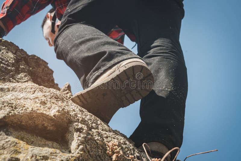 Man Hiker Steps on the Mountain Trail on the Rocks Stock Image - Image ...