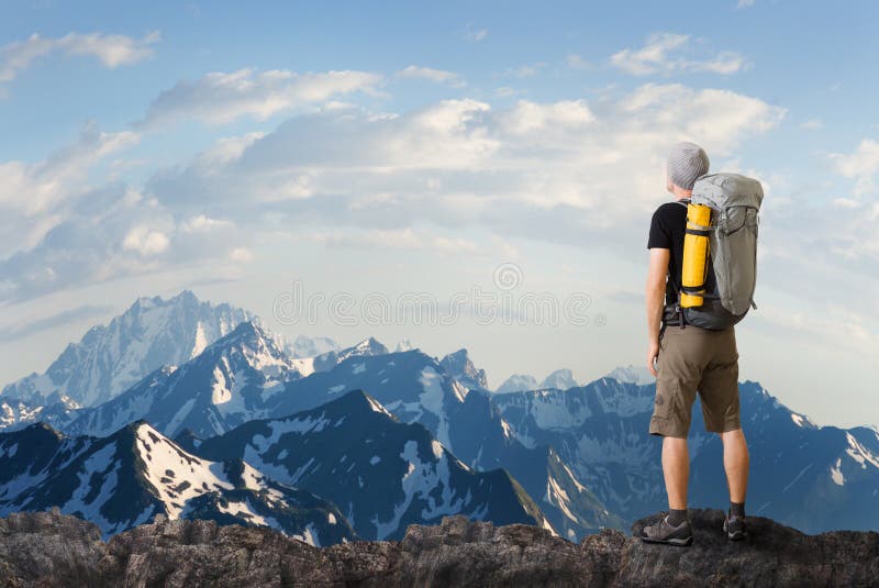 Man hiking in mountains stock image. Image of adventure - 76500049